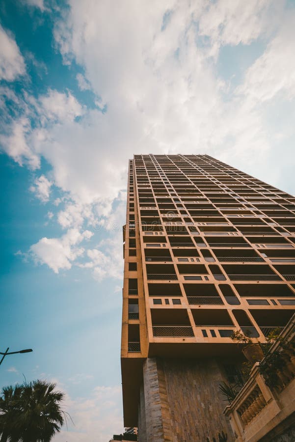 Vertical Low Angle Shot of a High Building Under the Cloudy Sky Stock ...