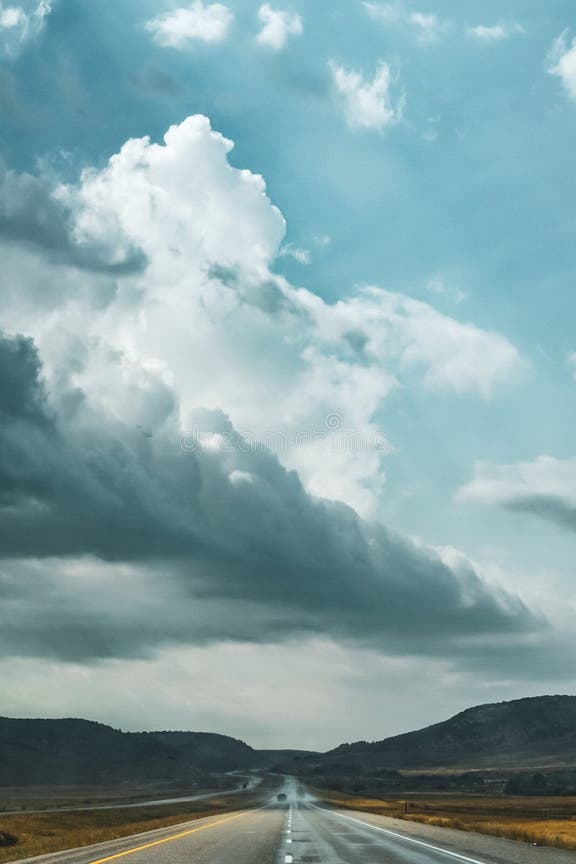 Vertical Low Angle Shot of a Highway Under the Breathtaking Clouds in ...