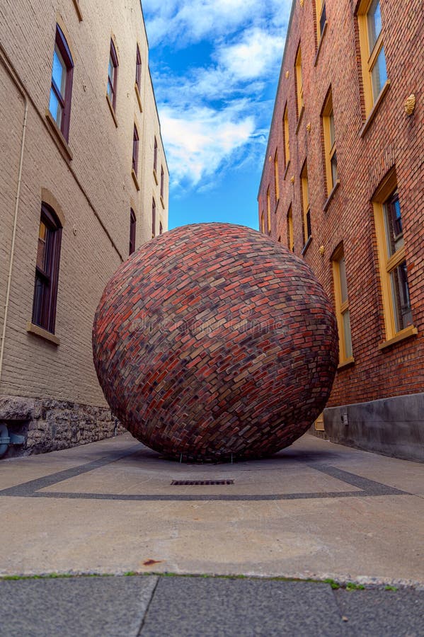 Vertical Low Angle Shot of a Huge Round Stone Structure between Two ...