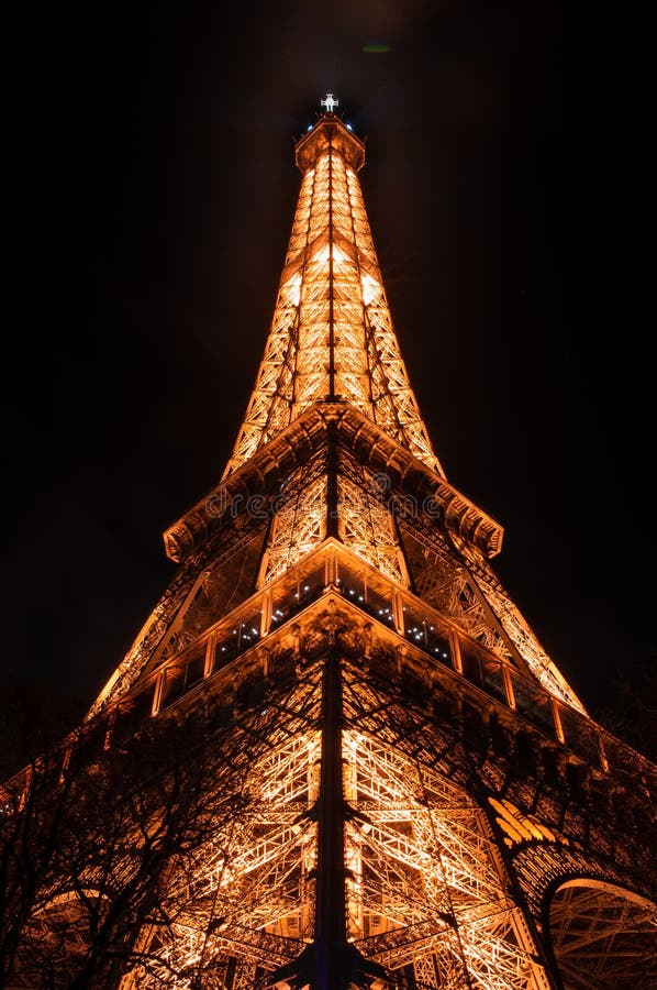Vertical Low Angle Shot of the Illuminated Eiffel Tower at Night in ... Vertical Low Angle Shot of the Illuminated Eiffel Tower at Night in ...