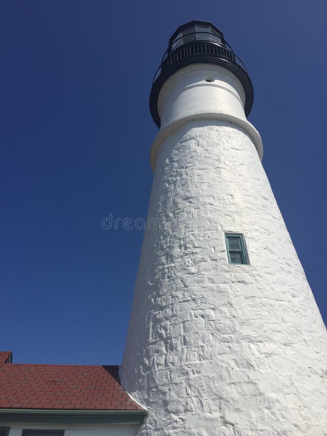 Vertical Low Angle Shot of a Lighthouse with a Clear Sky in the ...