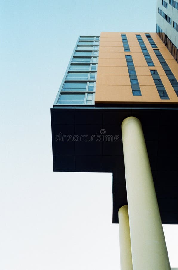 Vertical Low Angle Shot of a Modern Building on Two Huge Columns Stock ...