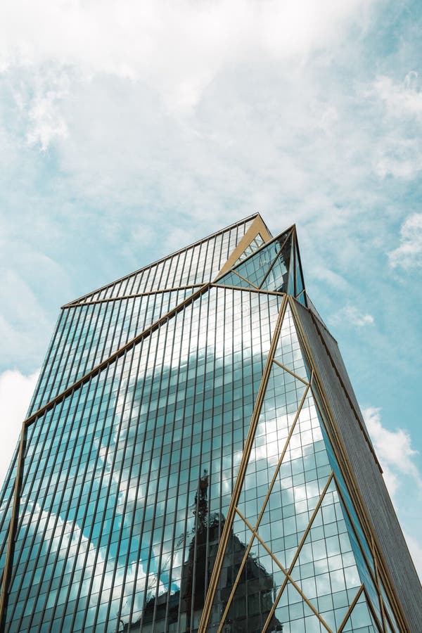 Vertical Low Angle Shot of a Modern Glass Skyscraper Building in ...