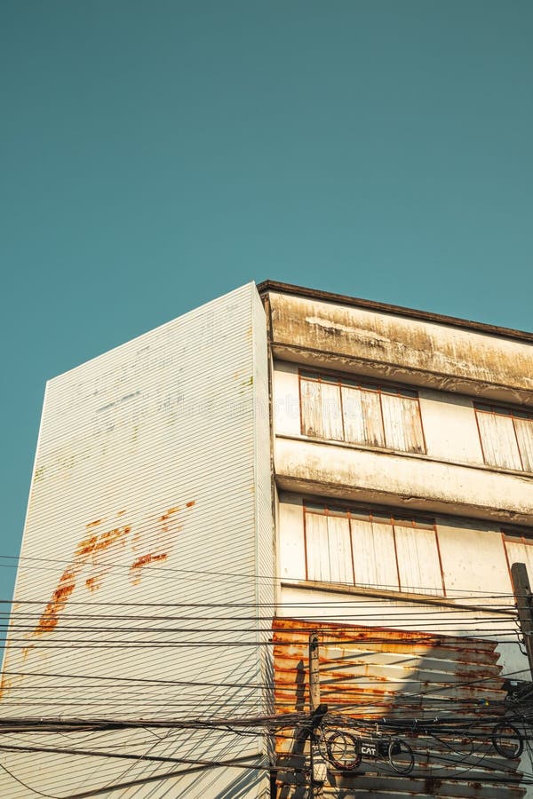 Vertical Low Angle Shot of an Old Rusty Building Exterior in Bangkok ...