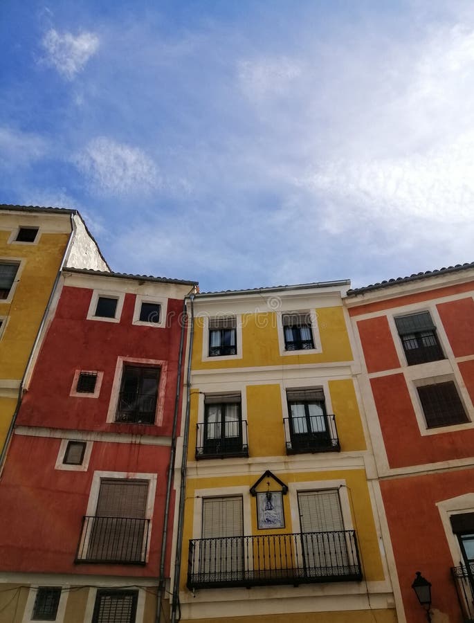 Vertical Low Angle Shot of Orange and Yellow Buildings in Cuenca Spain ...