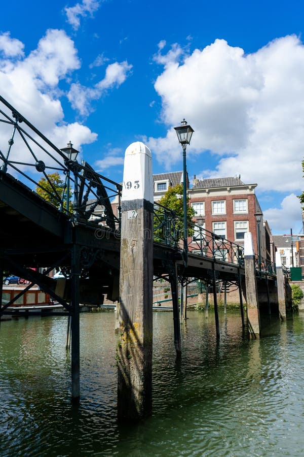 Vertical Low Angle Shot of a Pier with Wooden Posts on the Sides Stock ...