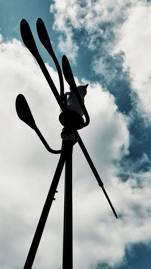 Vertical Low Angle Shot of the Silhouette of a Wind Sign Captured on a ...