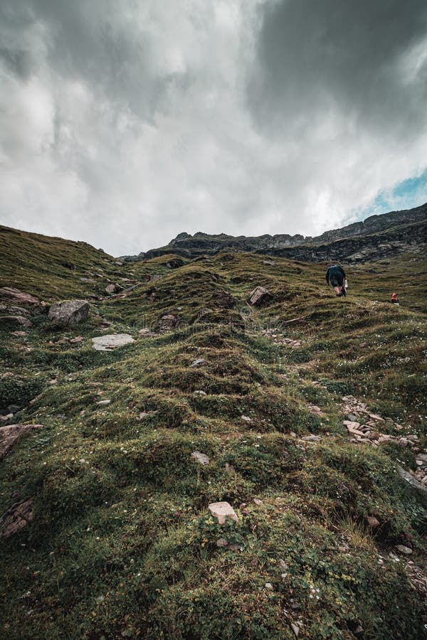 Vertical Low Angle Shot of a Steep Mountain on a Cloudy Day Stock Photo ...