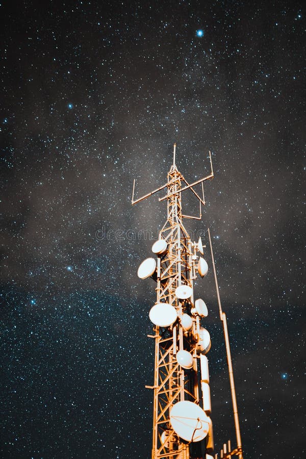 Vertical Low Angle Shot of a Telecommunication Tower Against a Starry ...