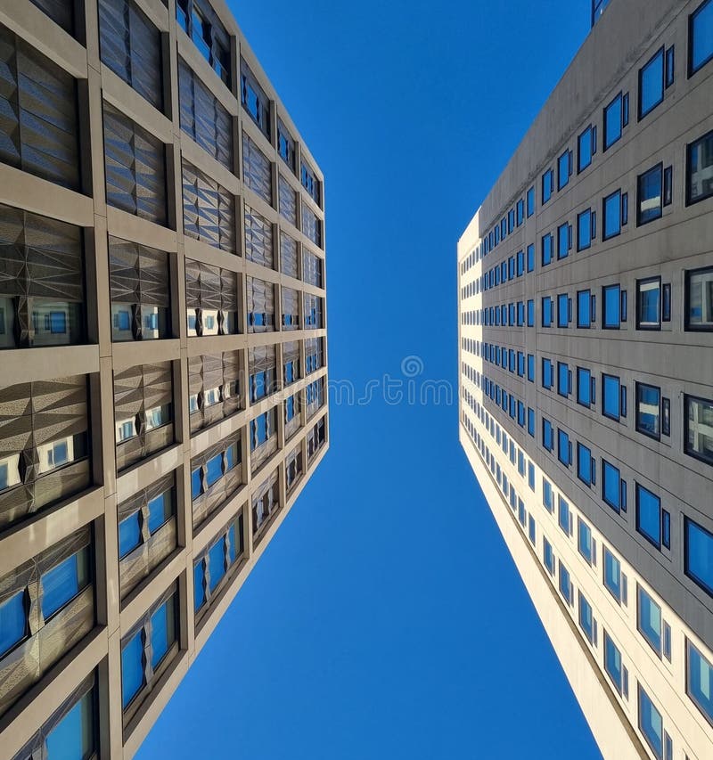 Vertical Low Angle Shot of Two Modern Buildings Opposite Each Other ...