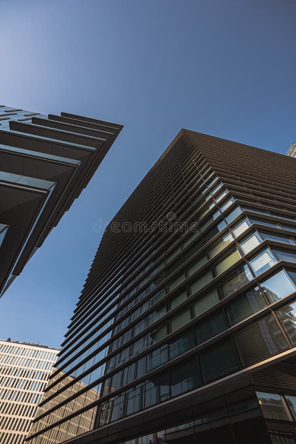 Vertical Low Angle View of High-rise Buildings Under the Sunlight and a ...