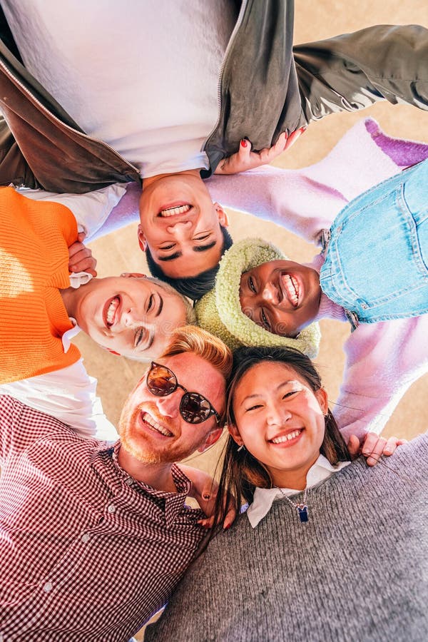 Vertical Low Angle View of a Multiracial Happy Young Friends Having Fun ...