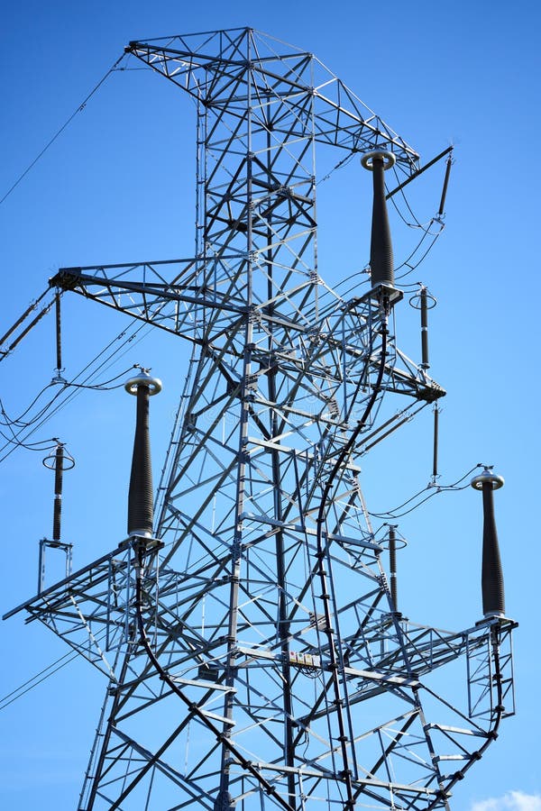 Vertical Low-angle View of a Transmission Tower with Electric Wires ...