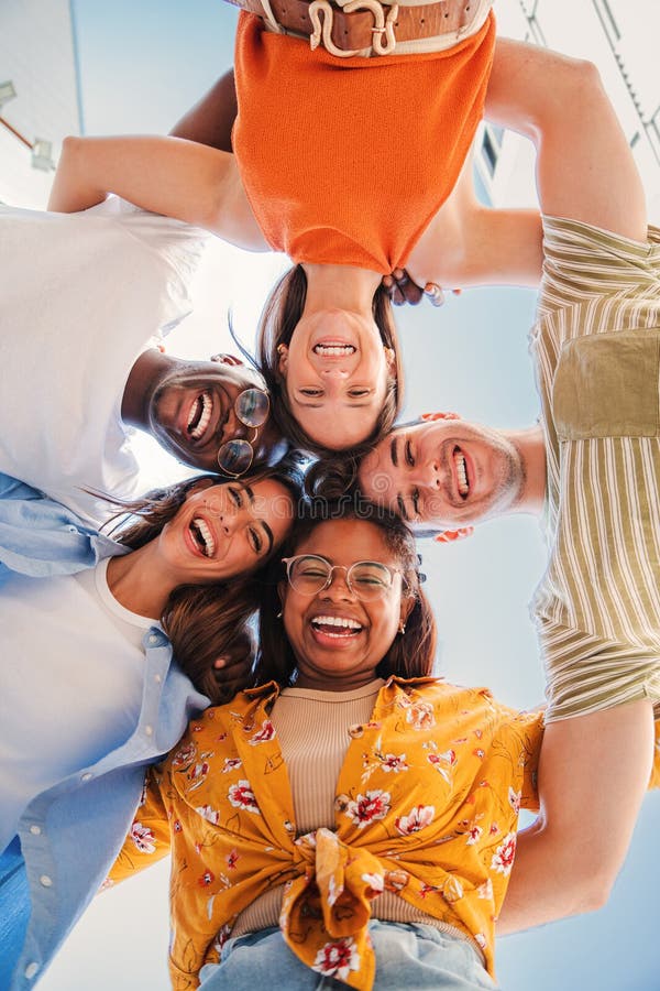 Vertical Low View Angle of a Group of Multiracial Teenagers Smiling and ...