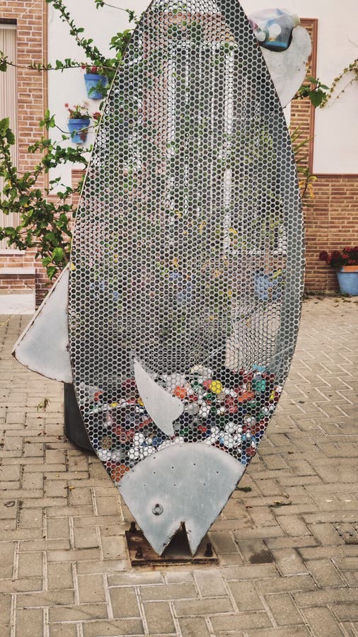 Vertical of a Metallic Recycling Bin in the Shape of a Fish for Plastic ...
