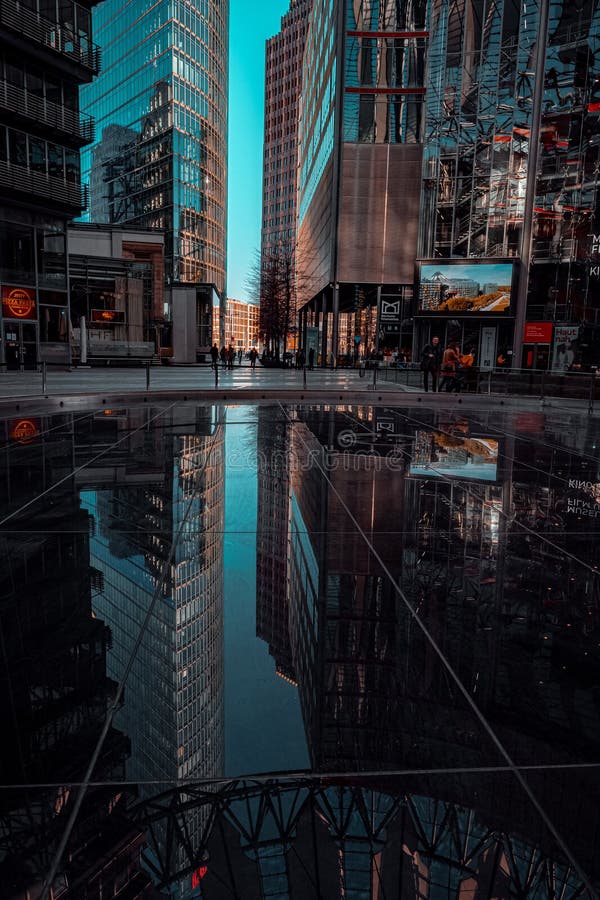 Vertical of Modern Buildings Reflecting on the Floor on the Streets of ...