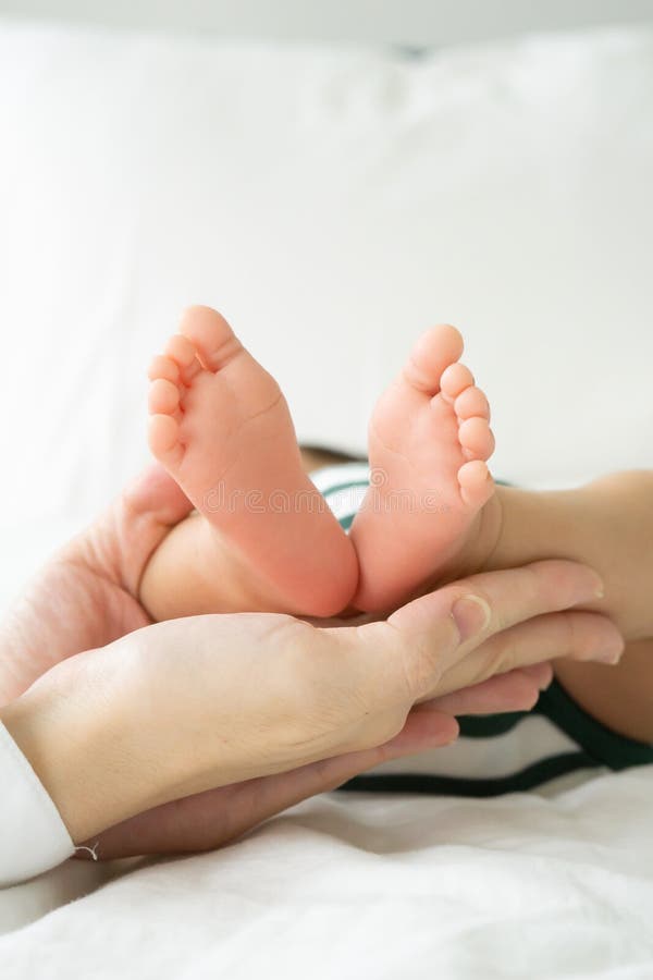 Vertical of Mother Hand Handle Gently Stock Photo - Image of healthy ...