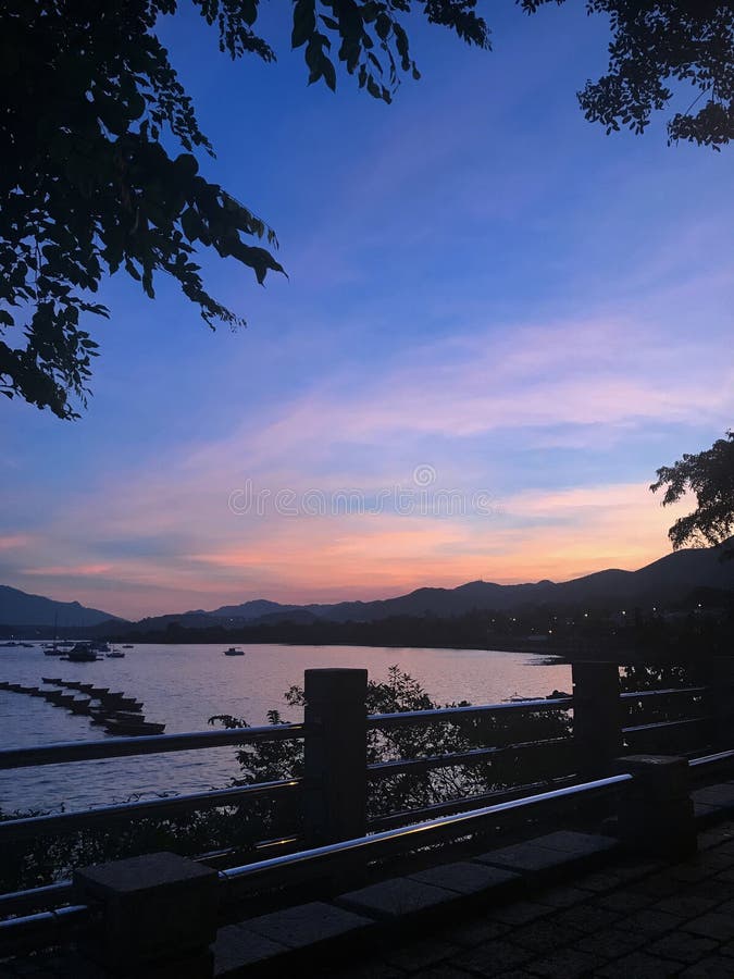 Vertical Mountain, Blue Sky, Recreational Boats,cloudscape at Sunset ...