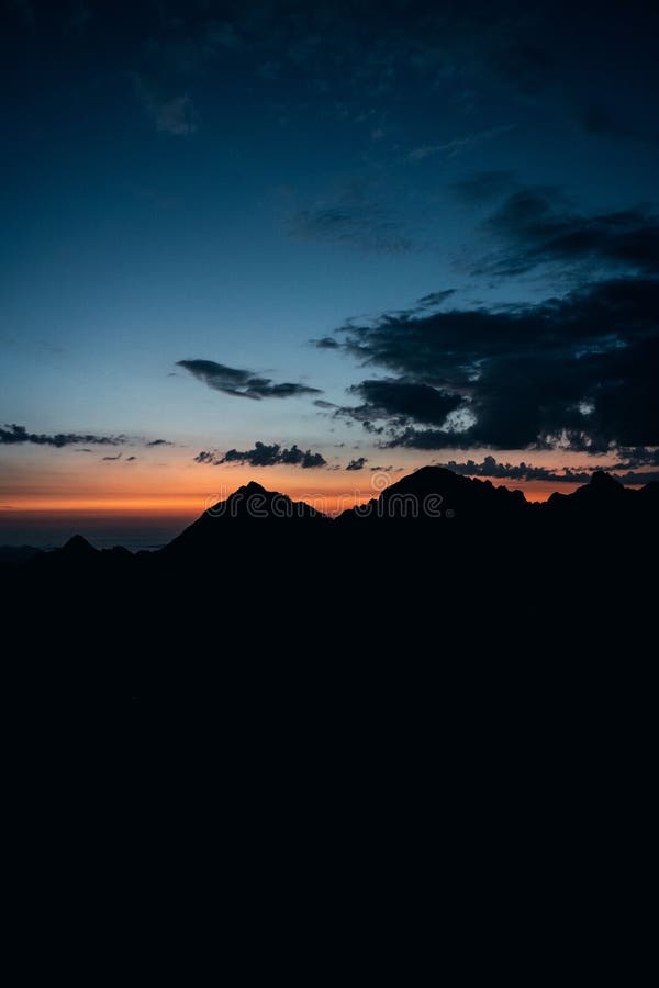 Vertical of a Mountains Range, Silhouette Skyline Against the Sunset ...