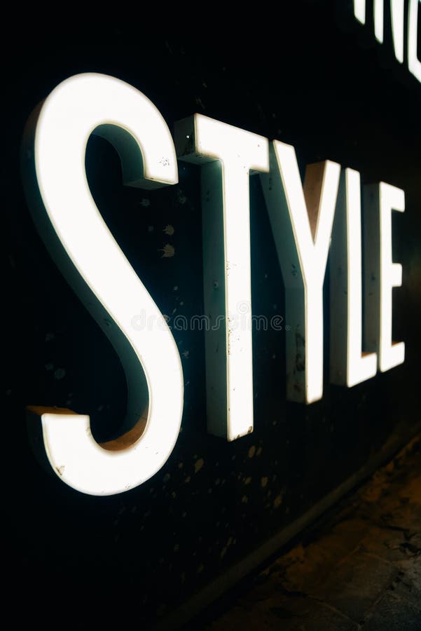 Vertical of a Neon Style Writing on a Black Wall. Stock Photo - Image ...