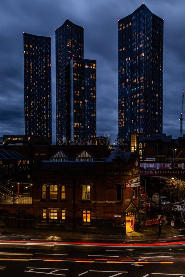 Vertical Night View of Deansgate Square with Four Skyscraper Towers ...