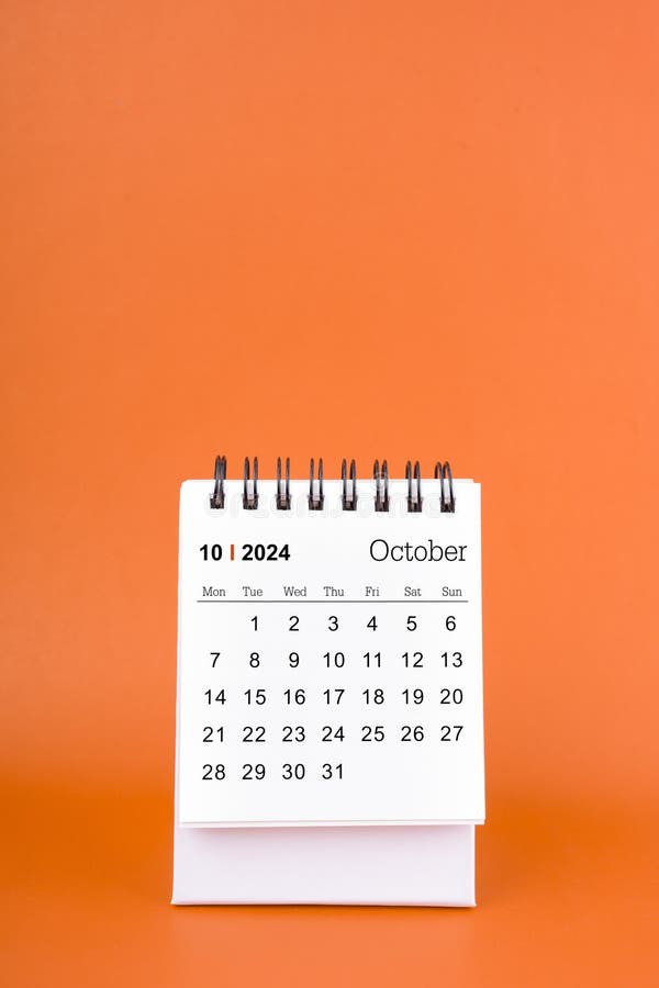 Vertical of October 2024 Table Calendar on Orange Background Stock ...