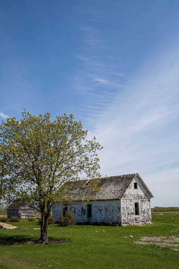 Vertical of an Old Farm with a Tree and a Building Stock Photo - Image ...