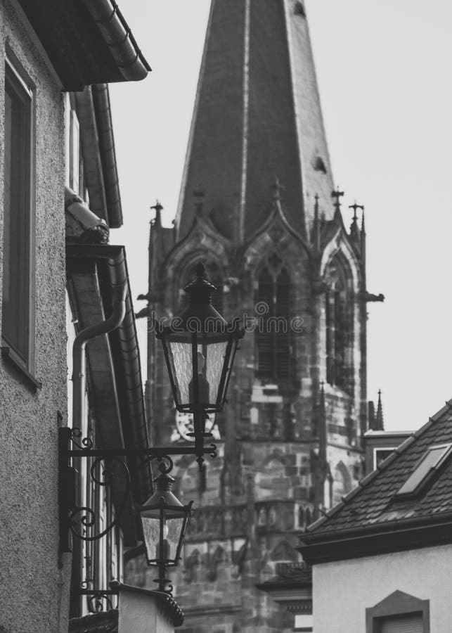 Vertical of an Old Lantern on a Building on a Background of a Gothic ...