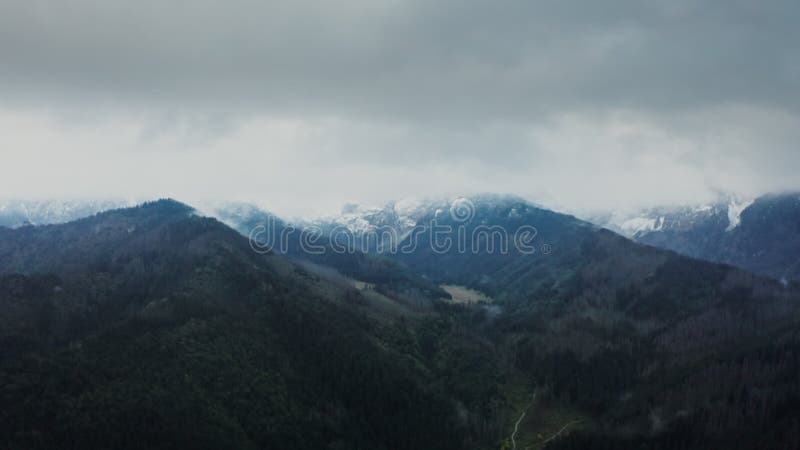 A River in a Lowland at the Foot of Gently Sloping Mountains with ...