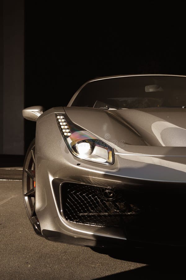 Vertical Partial View of a Gray Ferrari 488 Pista Tailor at Night ... Vertical Partial View of a Gray Ferrari 488 Pista Tailor at Night ...