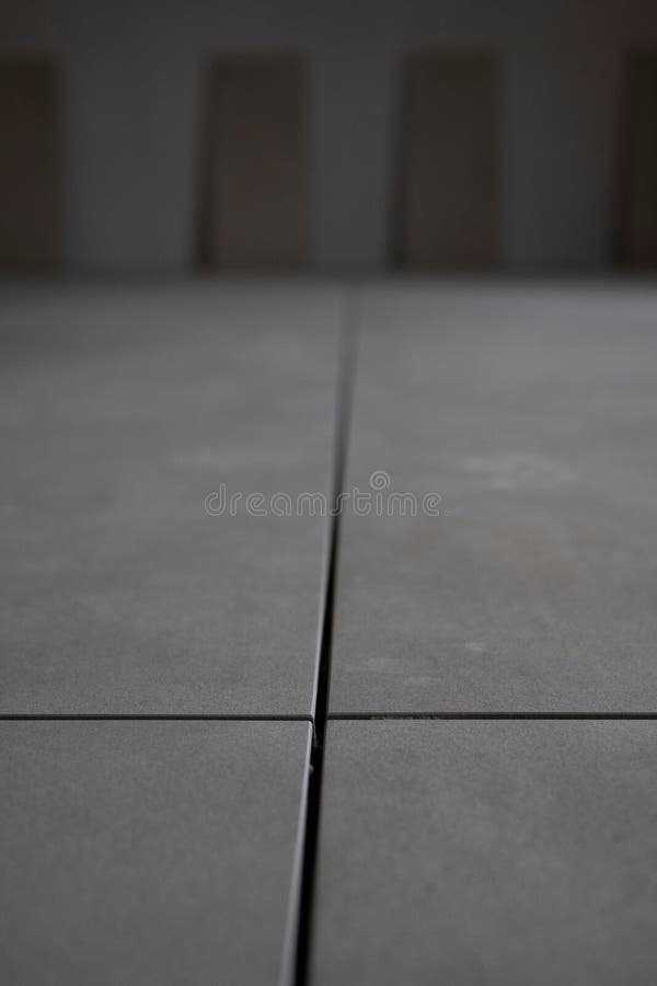 Vertical Partial View of the New Gray Tiled Floor - Tile Installation ...