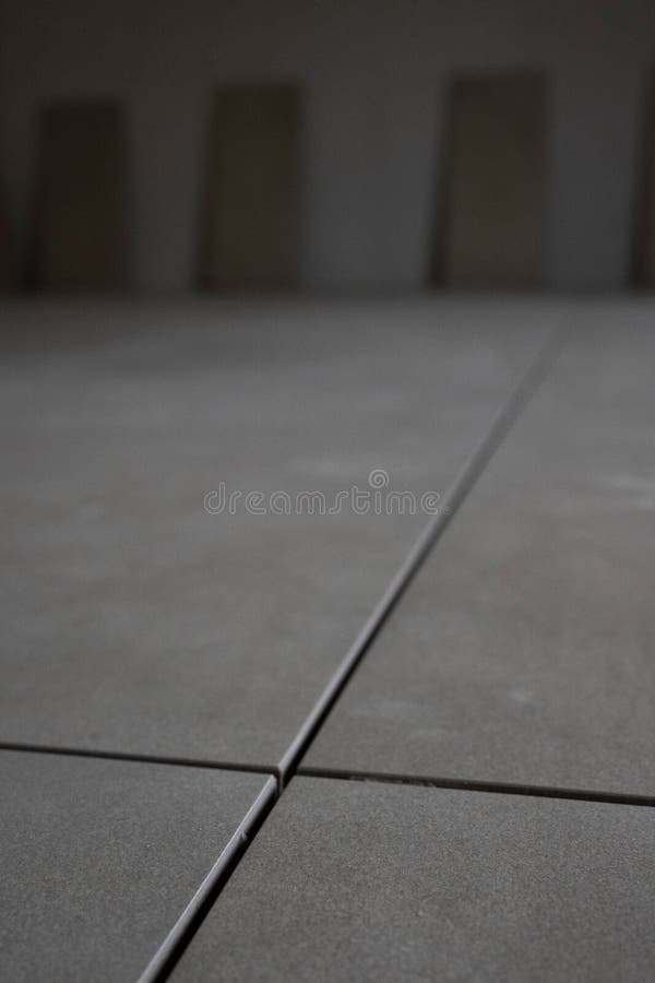 Vertical Partial View of the New Gray Tiled Floor - Tile Installation ... Vertical Partial View of the New Gray Tiled Floor - Tile Installation ...