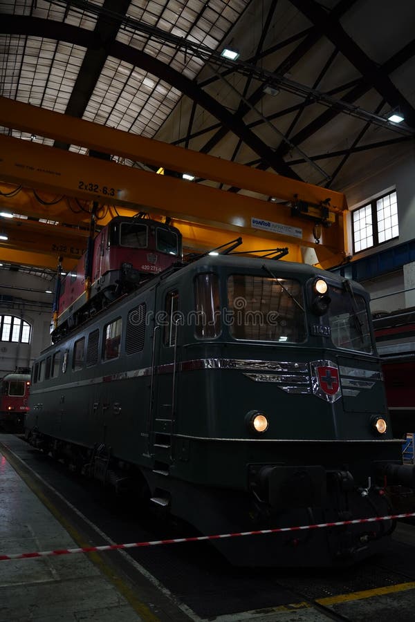 Passenger Train Travelling Down a Set of Railroad Tracks, Set Against a ...