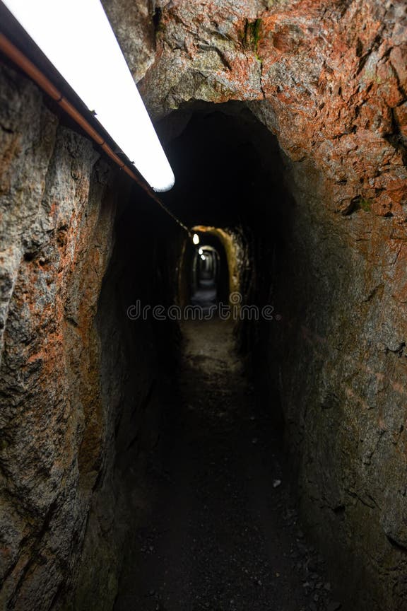 Vertical of the Pathway through a Cave Tunnel Stock Photo - Image of ...