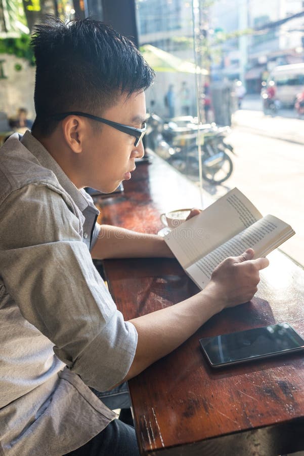 Asian Man Reading Book in the Morning Stock Image - Image of caucasian ...