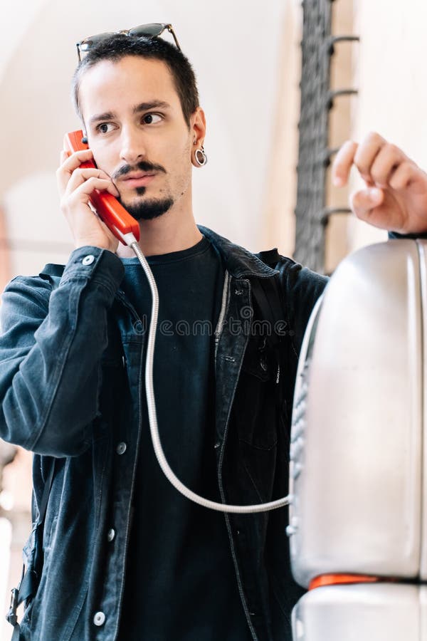 Vertical Photo of a Boy Calling through a Phone Booth Stock Photo ...