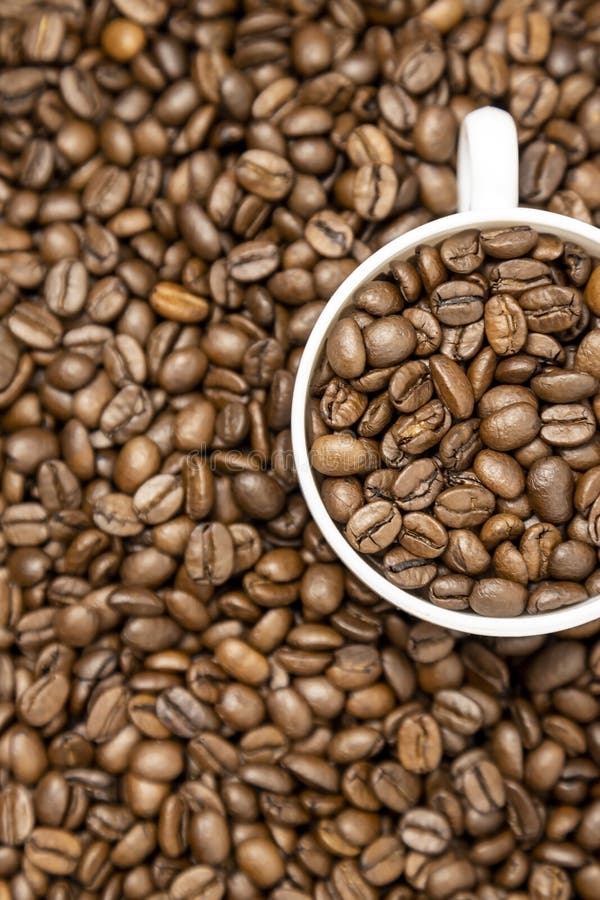 Vertical Photo of a Cup of Coffee Full of Coffee Beans. Top View of ...