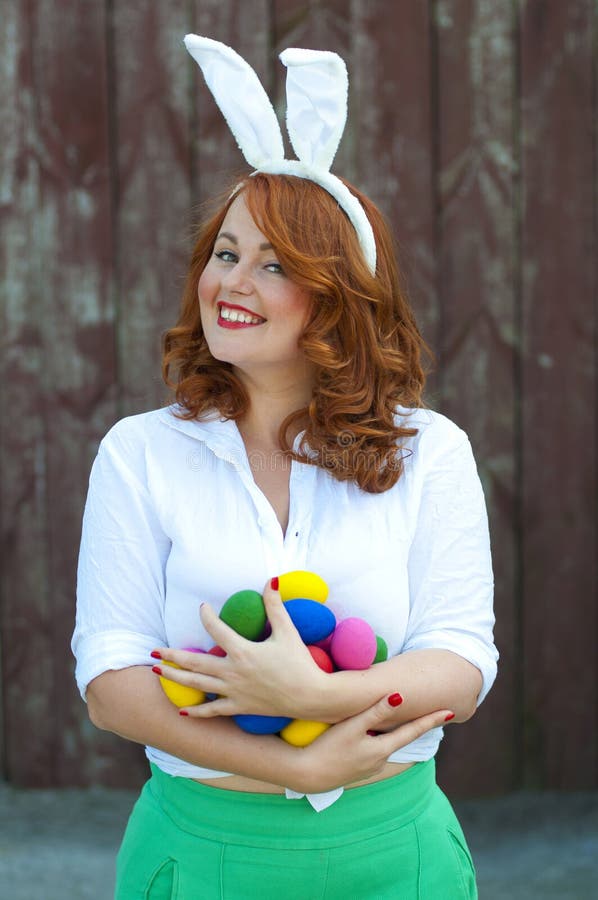 Vertical Photo Of A Pin Up Girl In A Rabbit Costume Who Is Sitting With