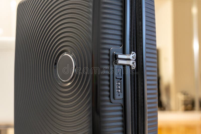 Vertical Photo of a Small Black Suitcase with a Zipper and a Digital ...