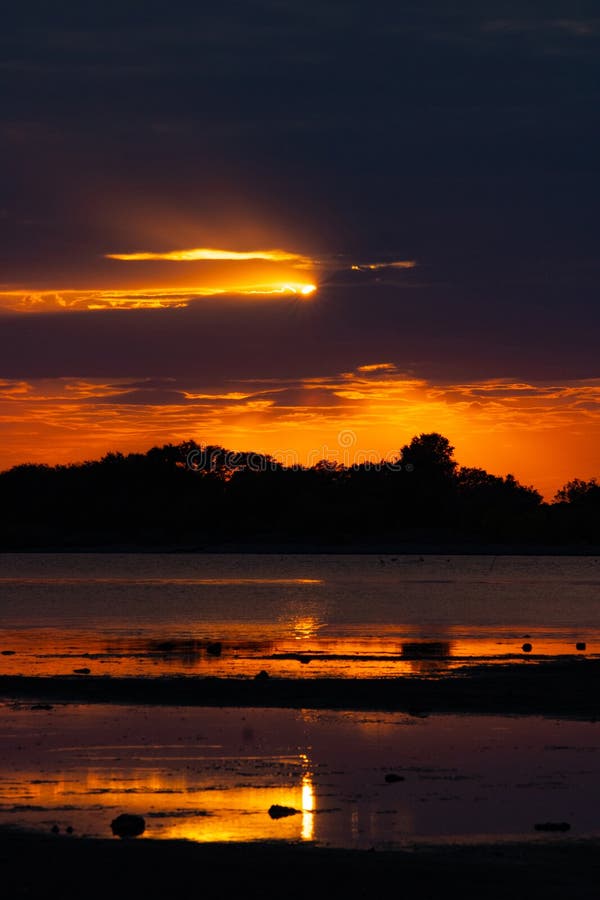 Vertical Photo of Reflections of Sunset Rays in Water Stock Image ...