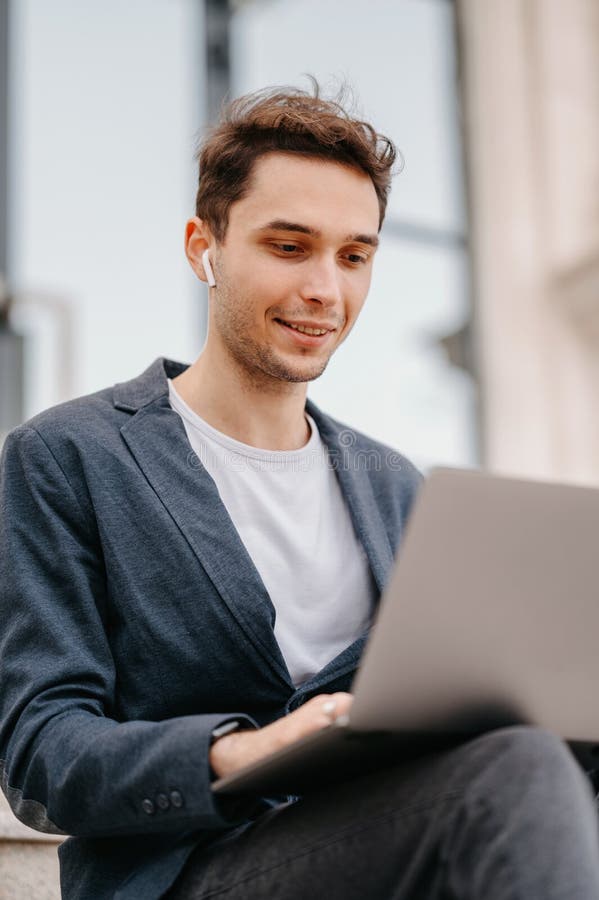 Vertical Photo of Young Freelancer Man Working Remote at Laptop ...