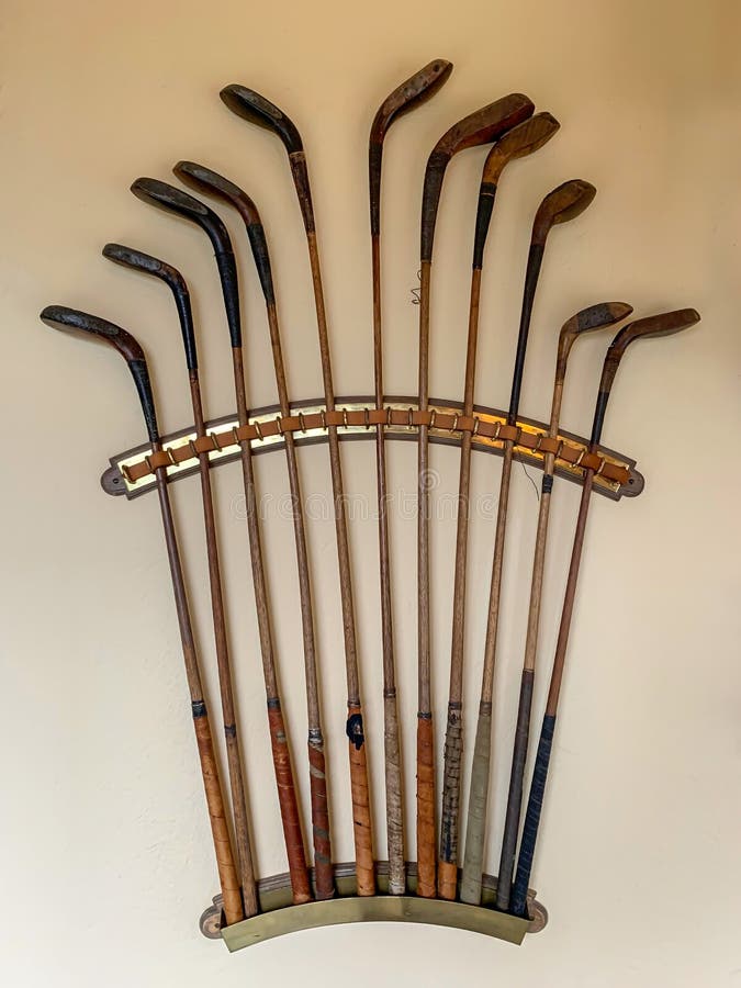 Vertical Picture of a Golf Club Collection on the Wall Under the Lights ...