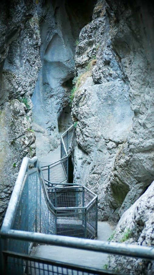 Vertical Picture of Handrails Leading To a Cave Under the Sunlight at ...