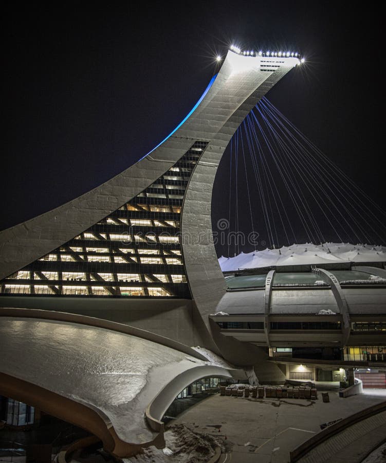 Vertical Picture of the Montreal Olympic Stadium with the Lights on in ...