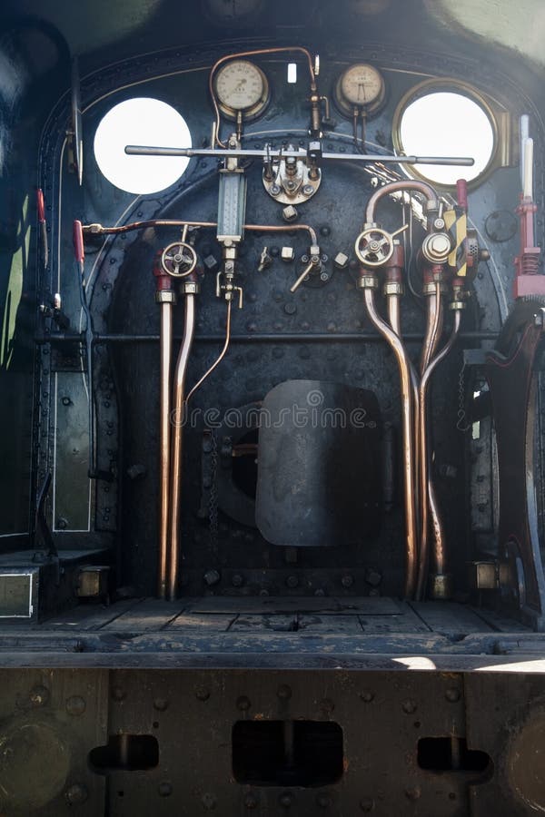 Vertical Picture of the Rusty Machine of a Train Under Sunlight in the ...