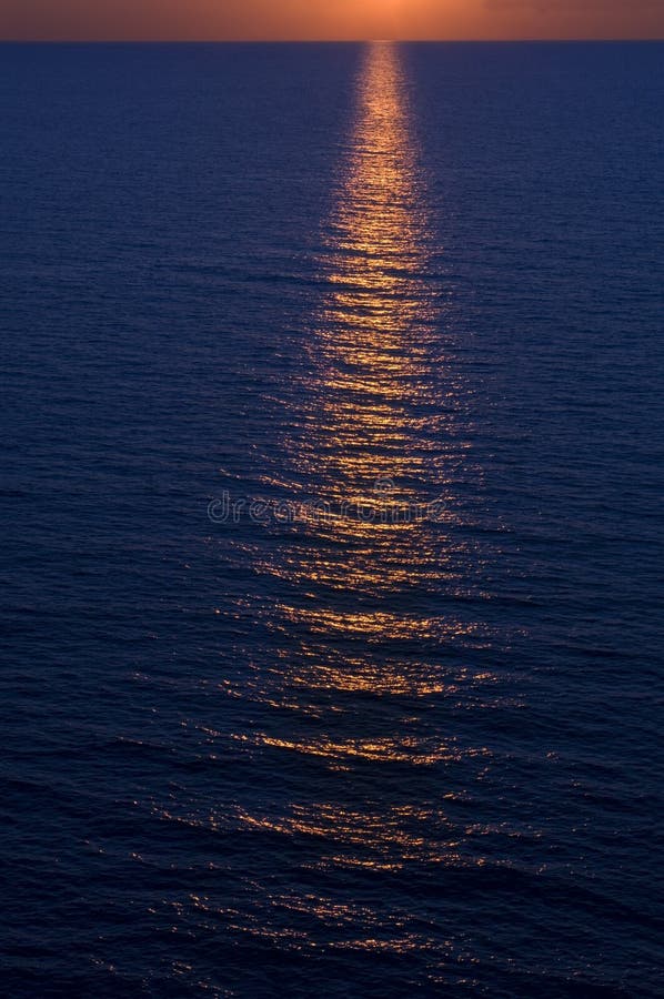 Vertical Picture of the Sea with the Sunset Reflecting on the Water in ...