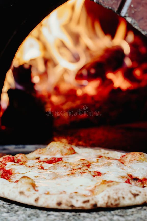 Vertical of a Pizza Cooked in the Oven Stock Image - Image of melted ...