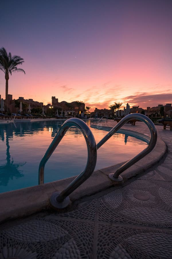 Vertical of a Pool and a Ladder Captured at a Beautiful Sunset View ...