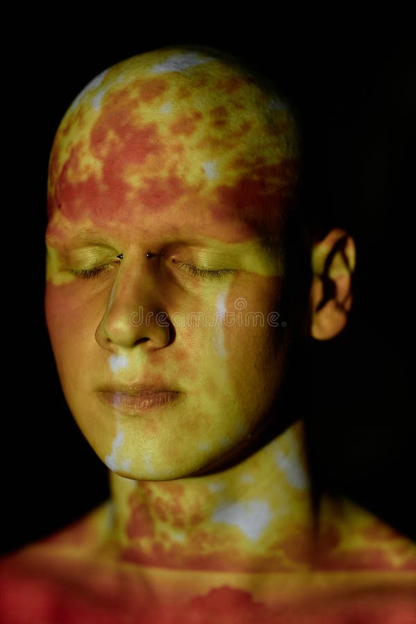 Portrait of Bald Man with Eyes Closed Posing with Image of Atomic ...
