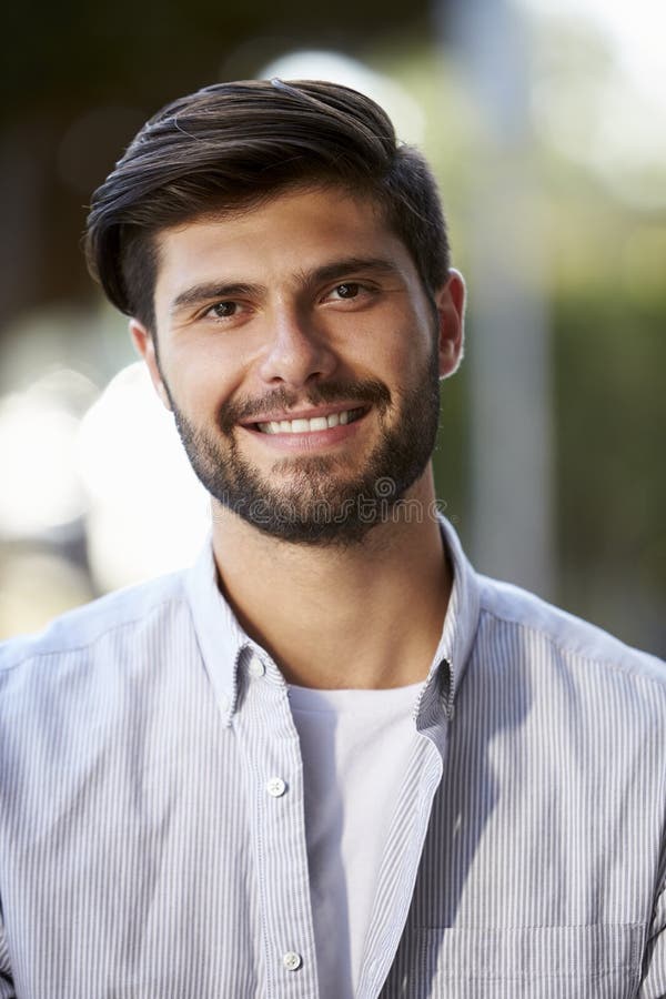 Vertical Portrait of Bearded Young Man Sitting Outside Stock Image ...